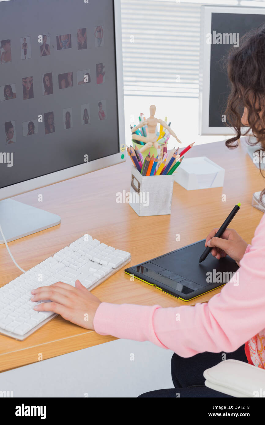 Editor using graphics tablet to do work Stock Photo - Alamy