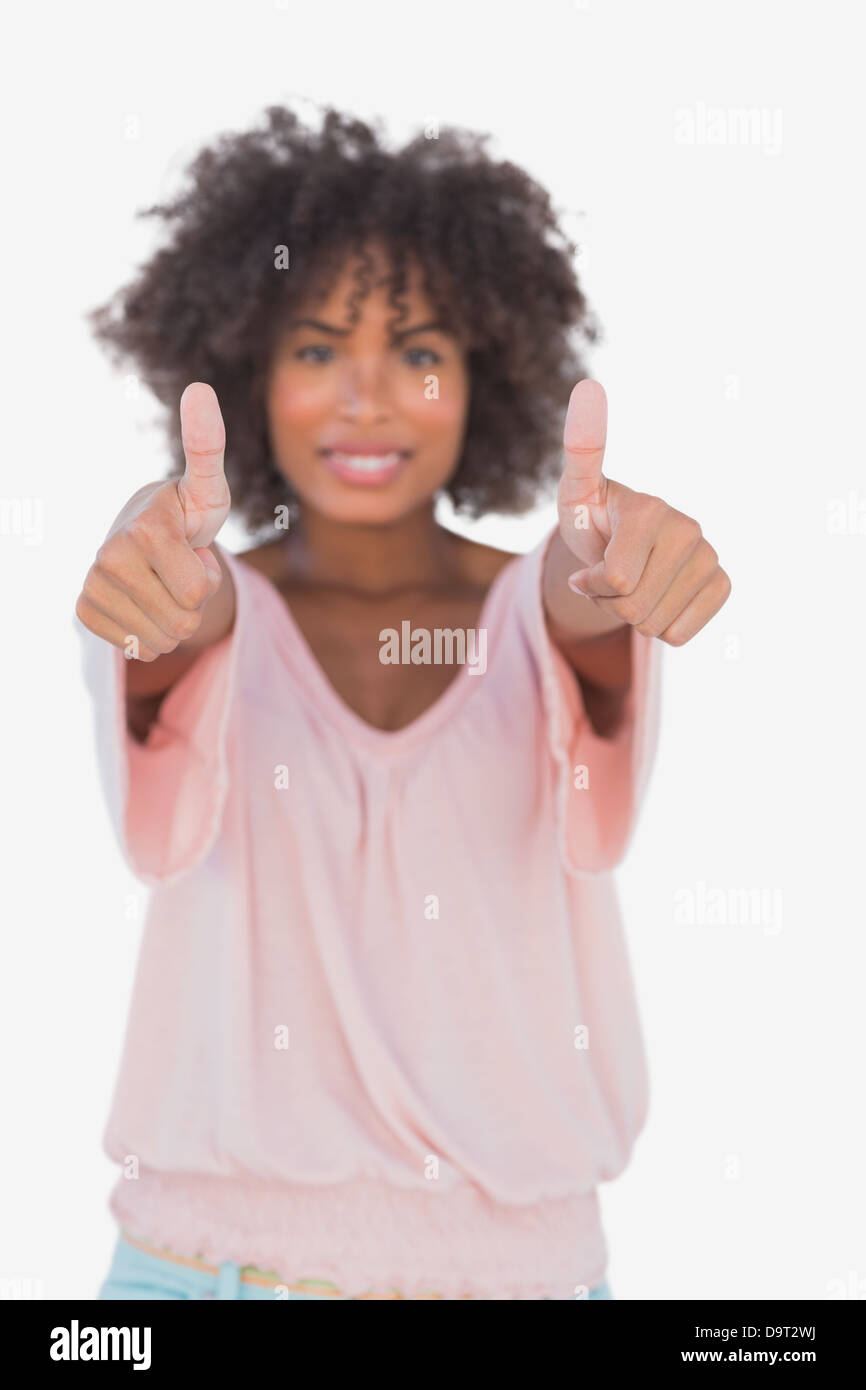 Smiling woman giving thumbs up Stock Photo - Alamy