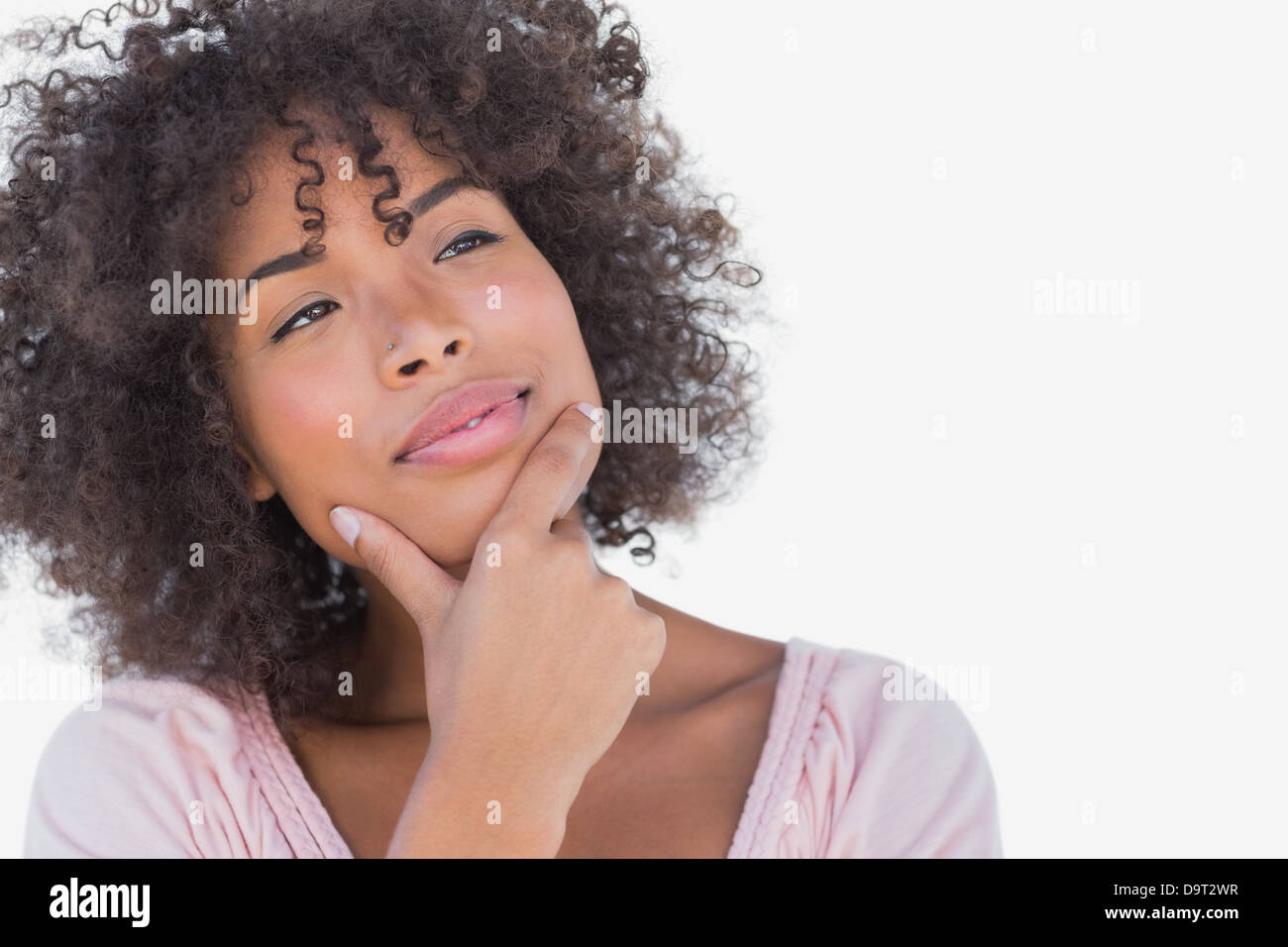 Pretty woman looking thoughtful Stock Photo - Alamy