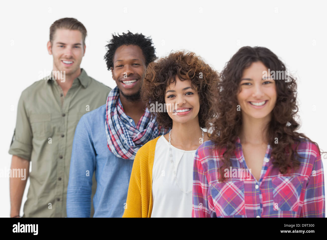 Four stylish friends standing in a row Stock Photo - Alamy