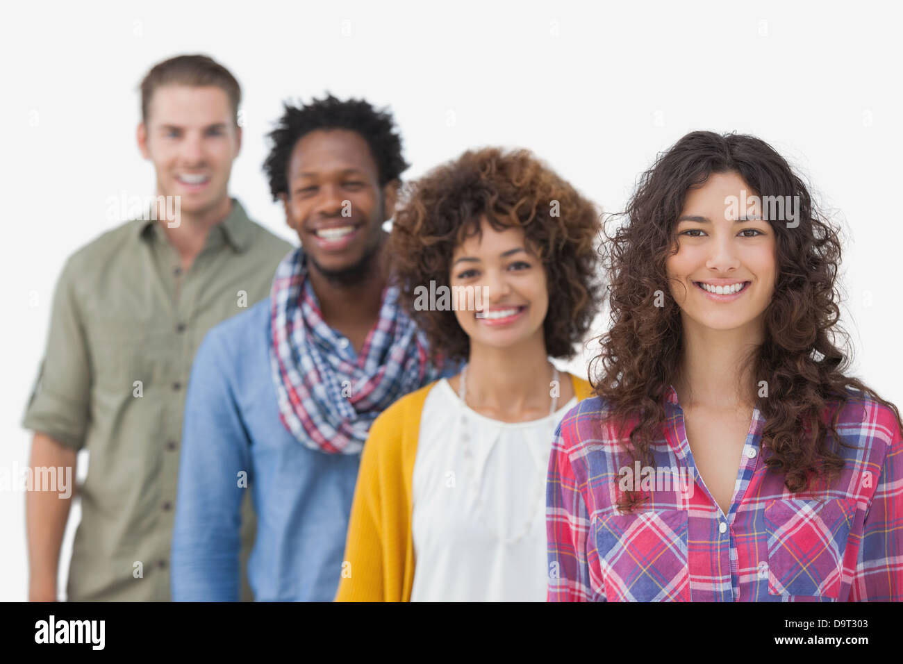 Four stylish friends standing in a line Stock Photo - Alamy