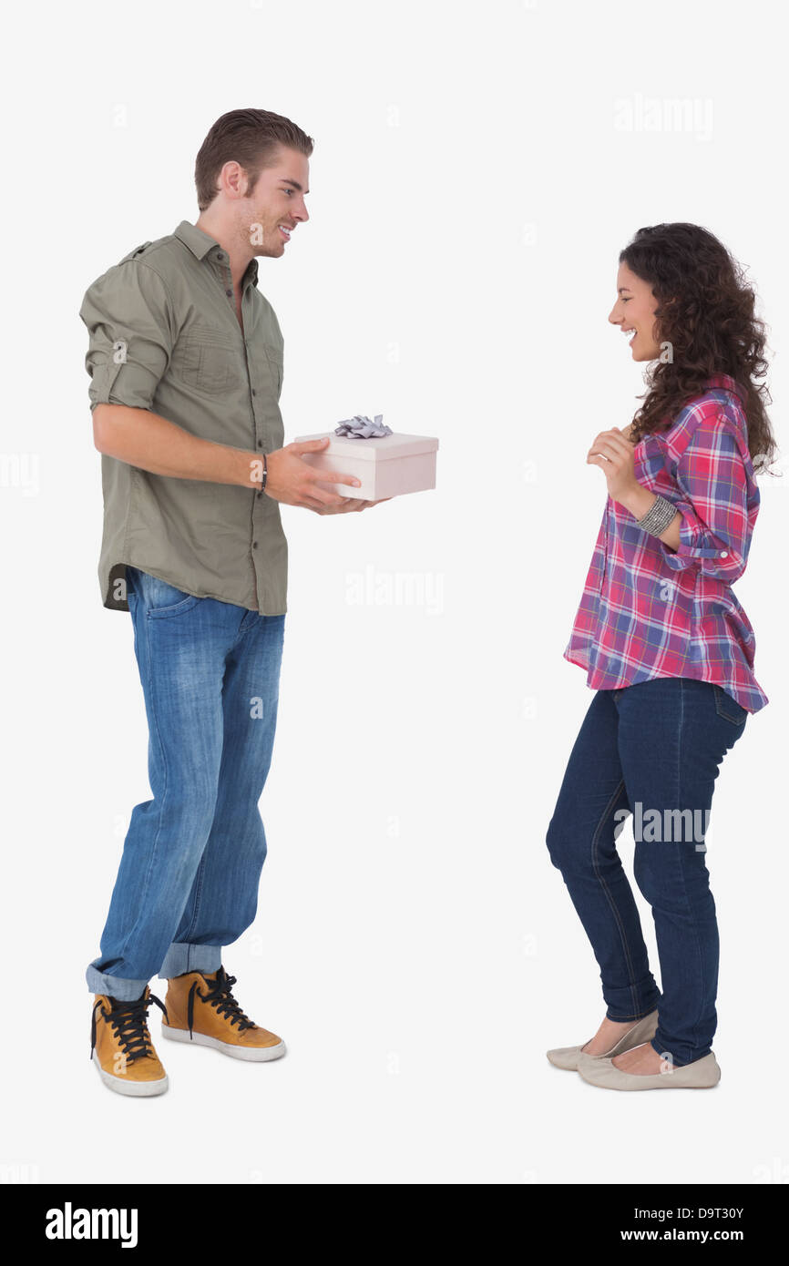 Man giving his friend a present Stock Photo - Alamy