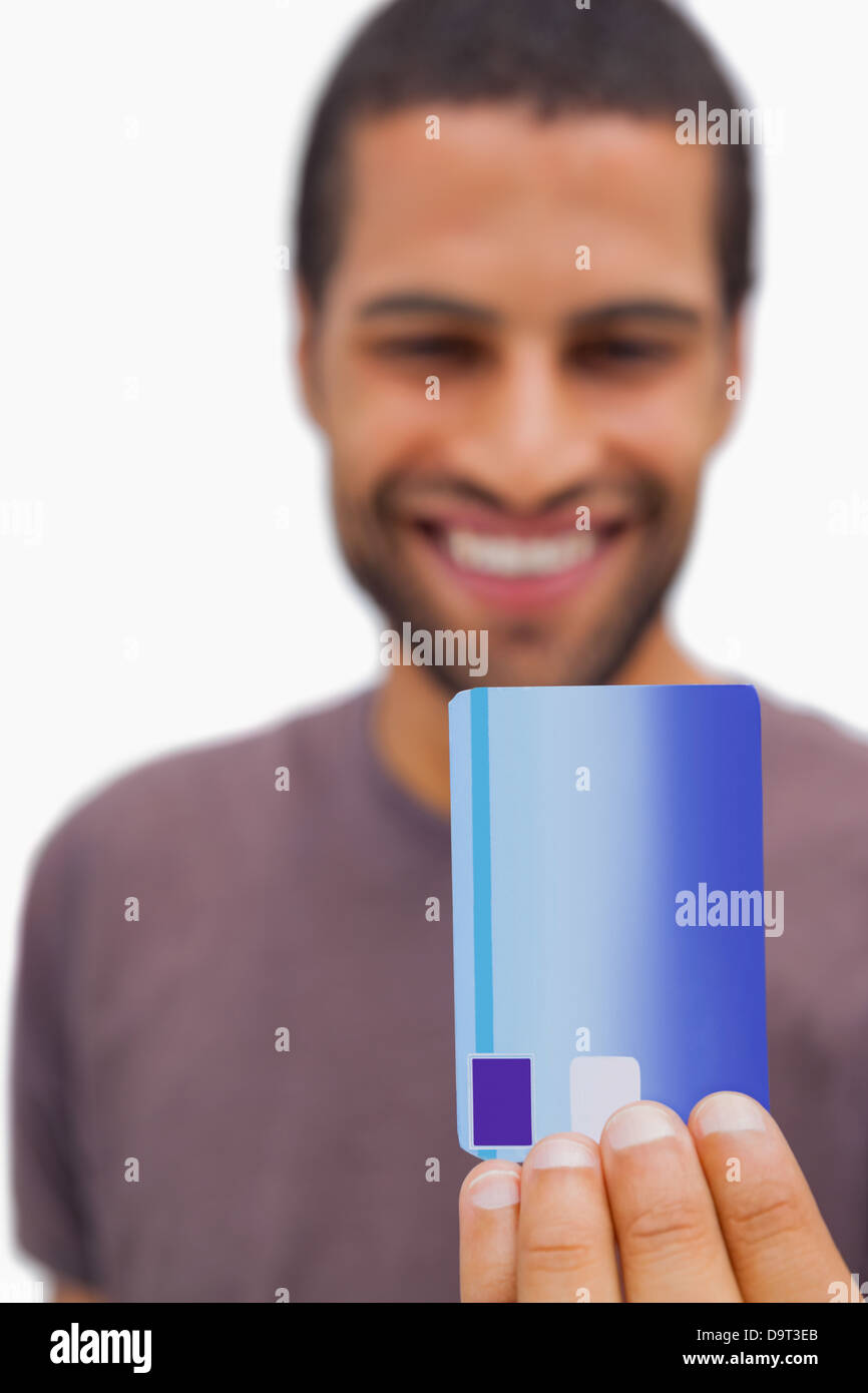 Handsome man holding credit card Stock Photo - Alamy
