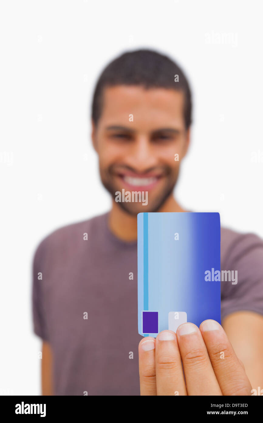 Handsome man showing credit card Stock Photo - Alamy