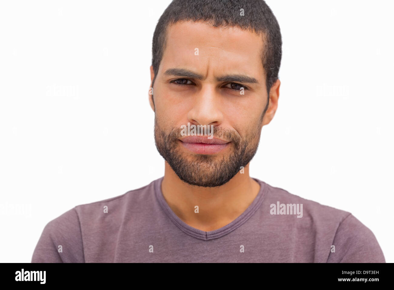 Handsome man frowning Stock Photo - Alamy