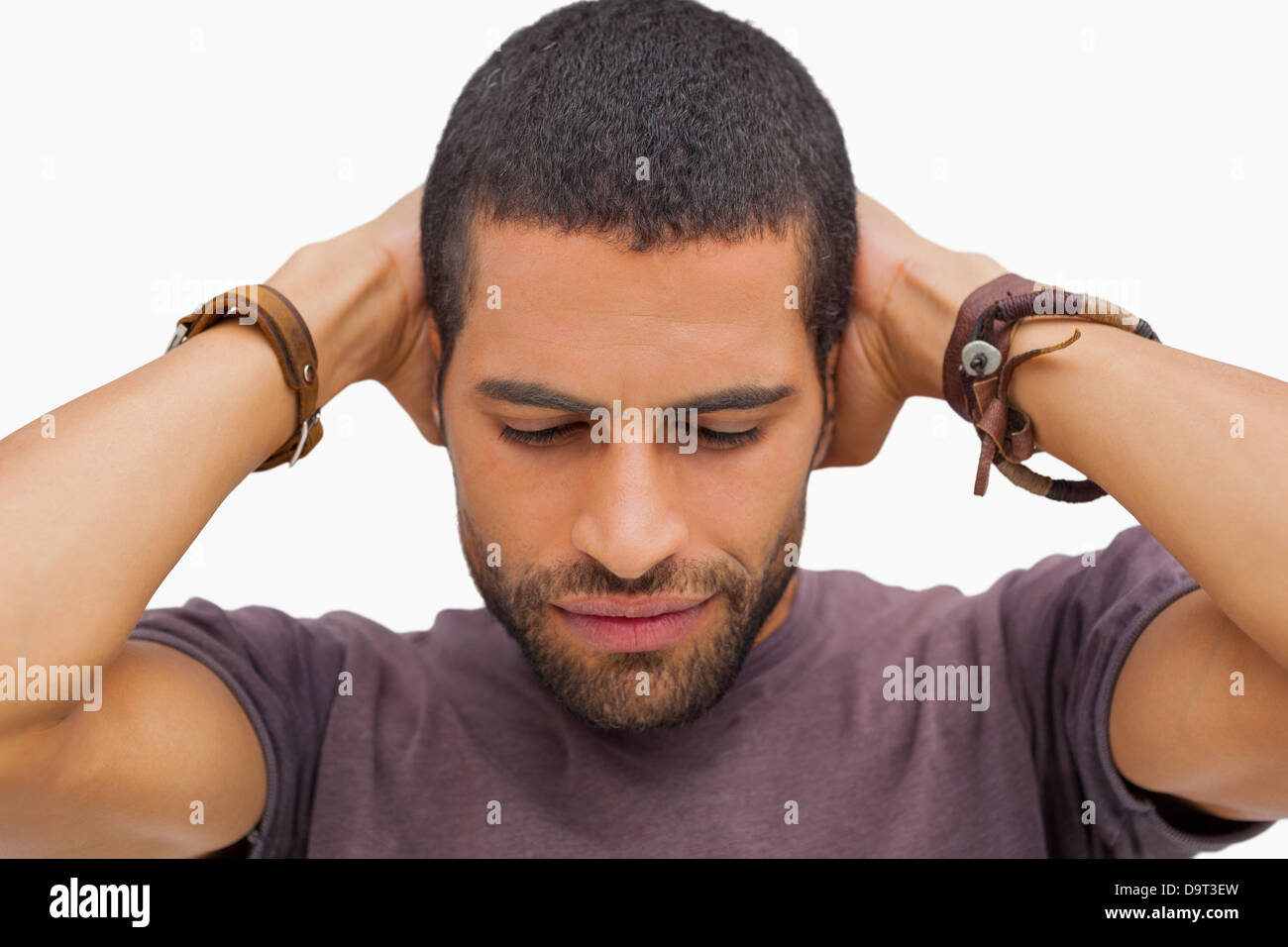Handsome man with hands on head Stock Photo - Alamy