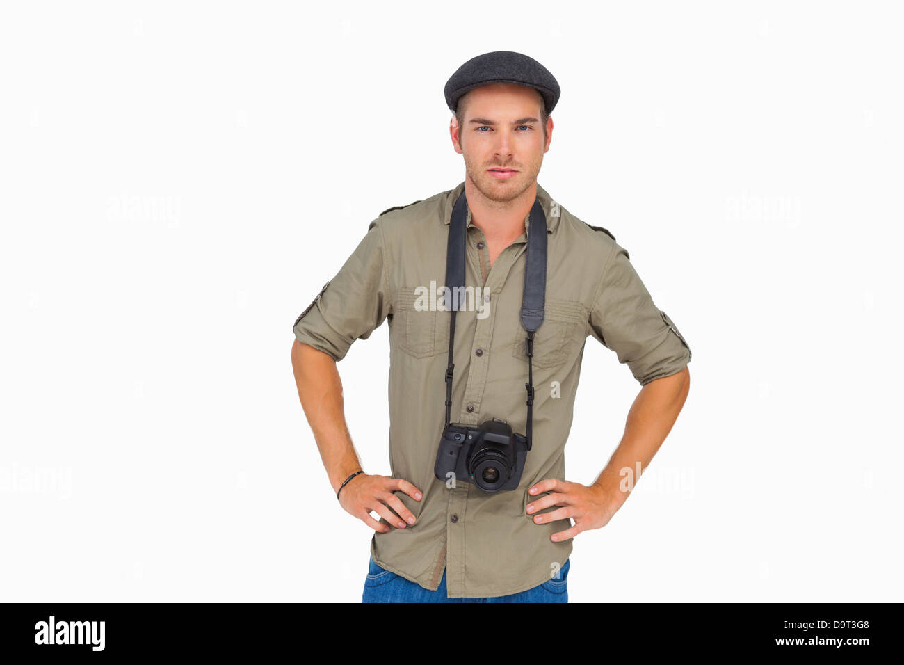 Serious man in peaked cap with camera around his neck Stock Photo - Alamy