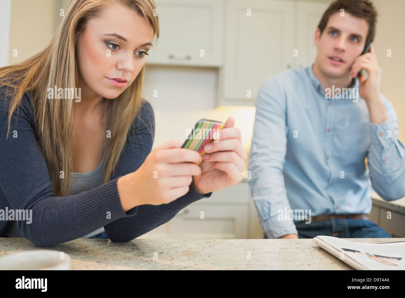 Man calling while woman texting Stock Photo - Alamy