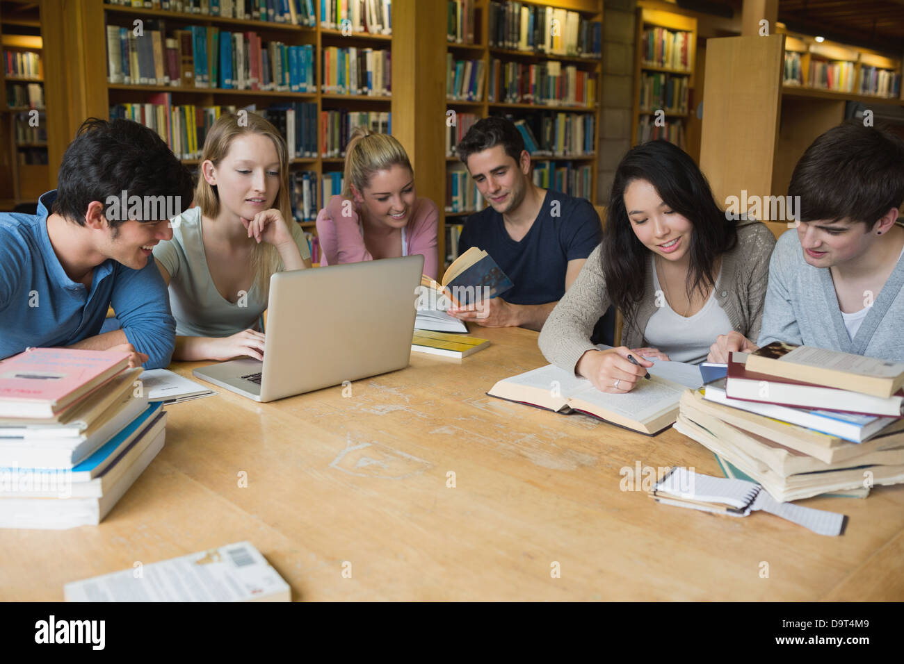 Students learning in a library Stock Photo - Alamy