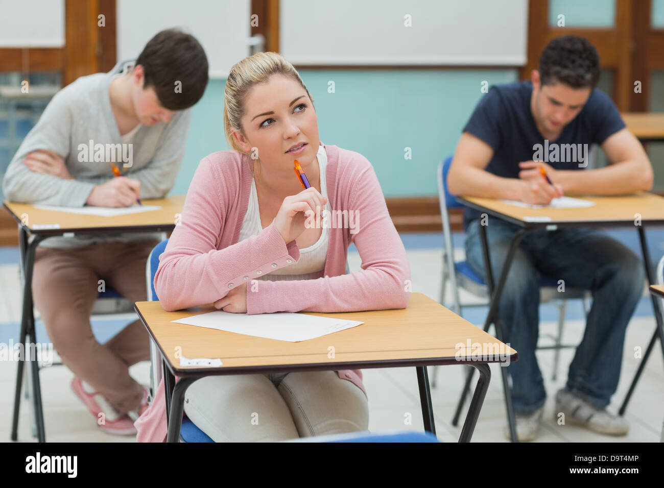 Thoughtful students studying in a classroom Stock Photo - Alamy