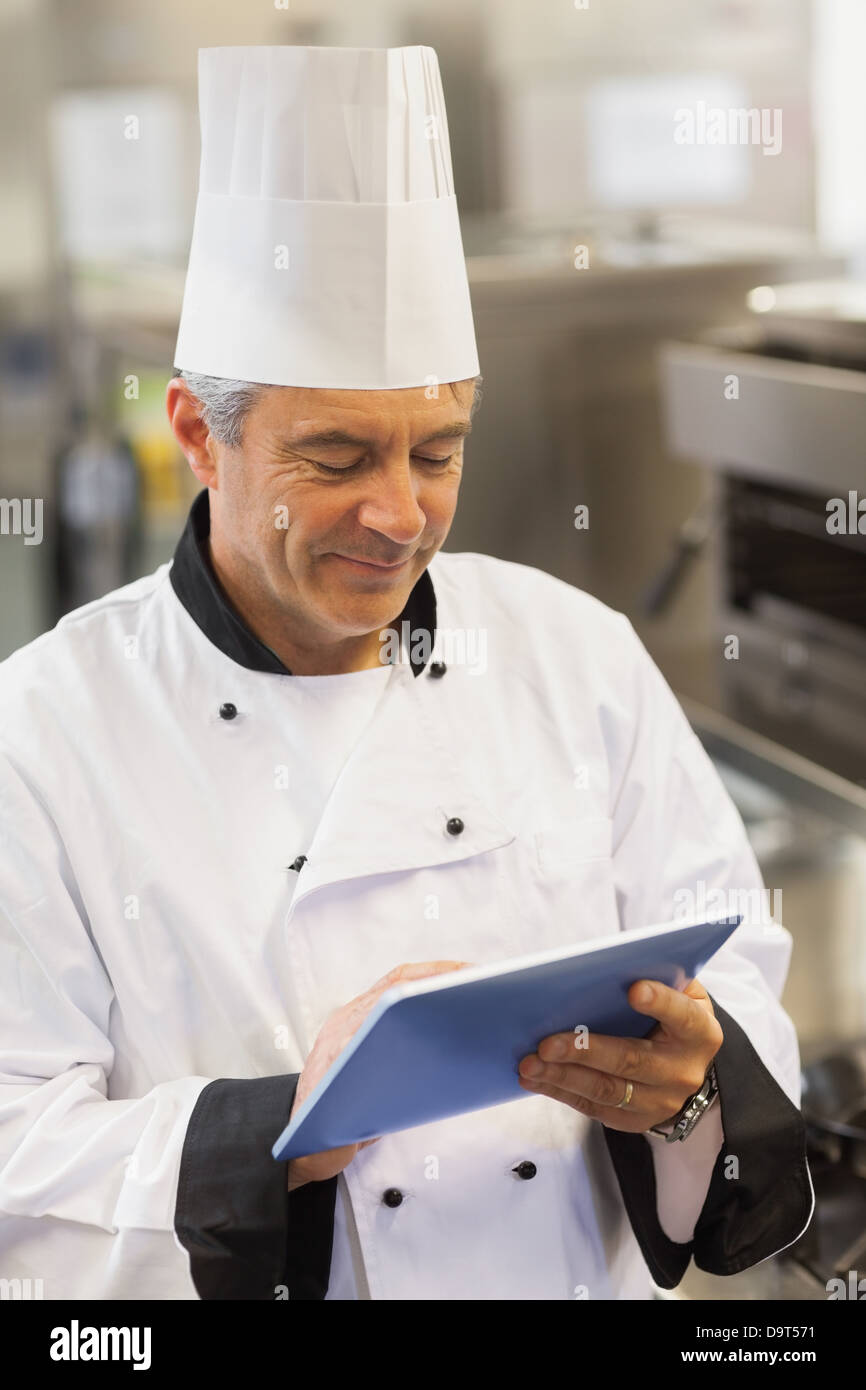 Chef touching his digital tablet Stock Photo - Alamy