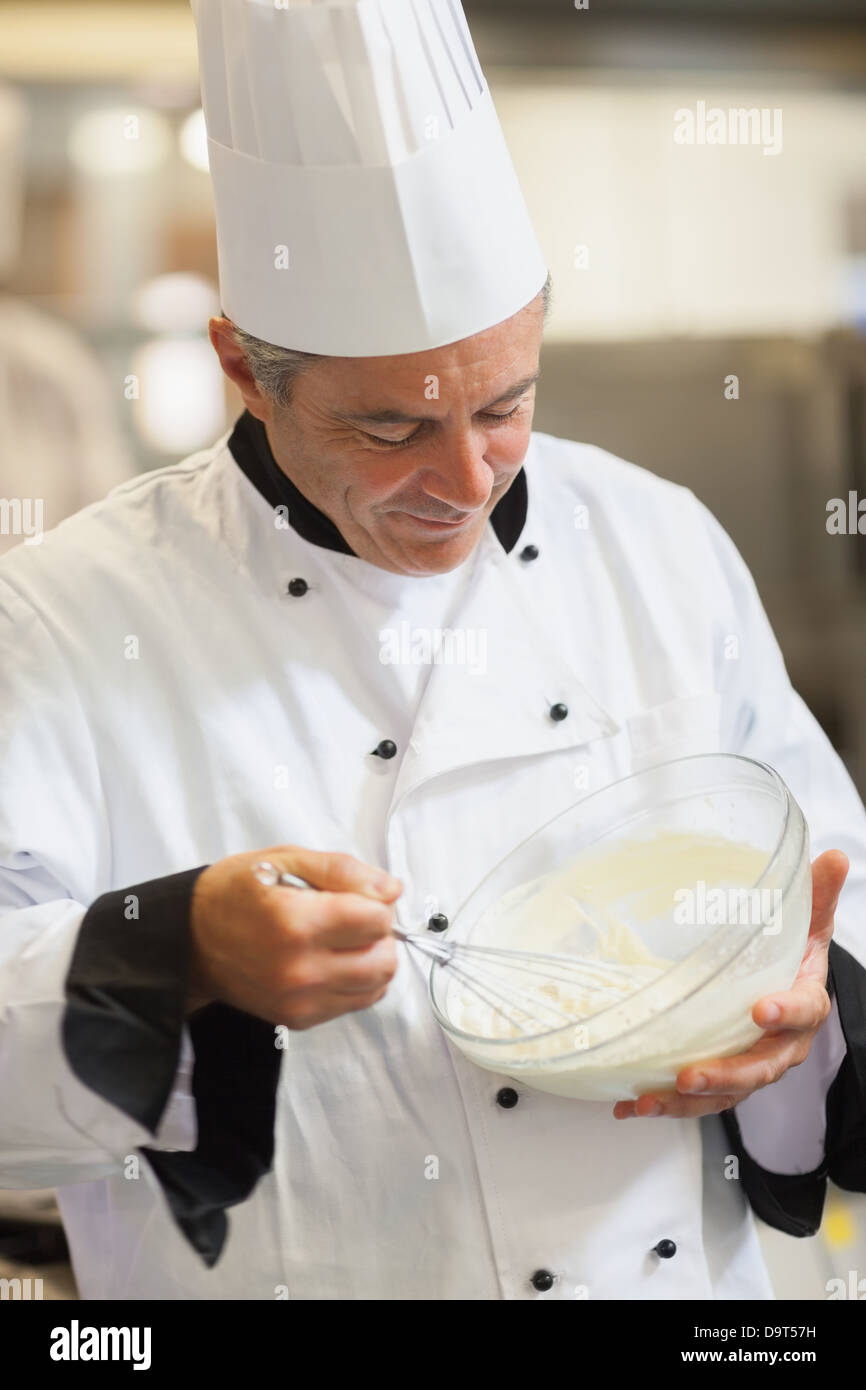 Chef whisking cream Stock Photo - Alamy