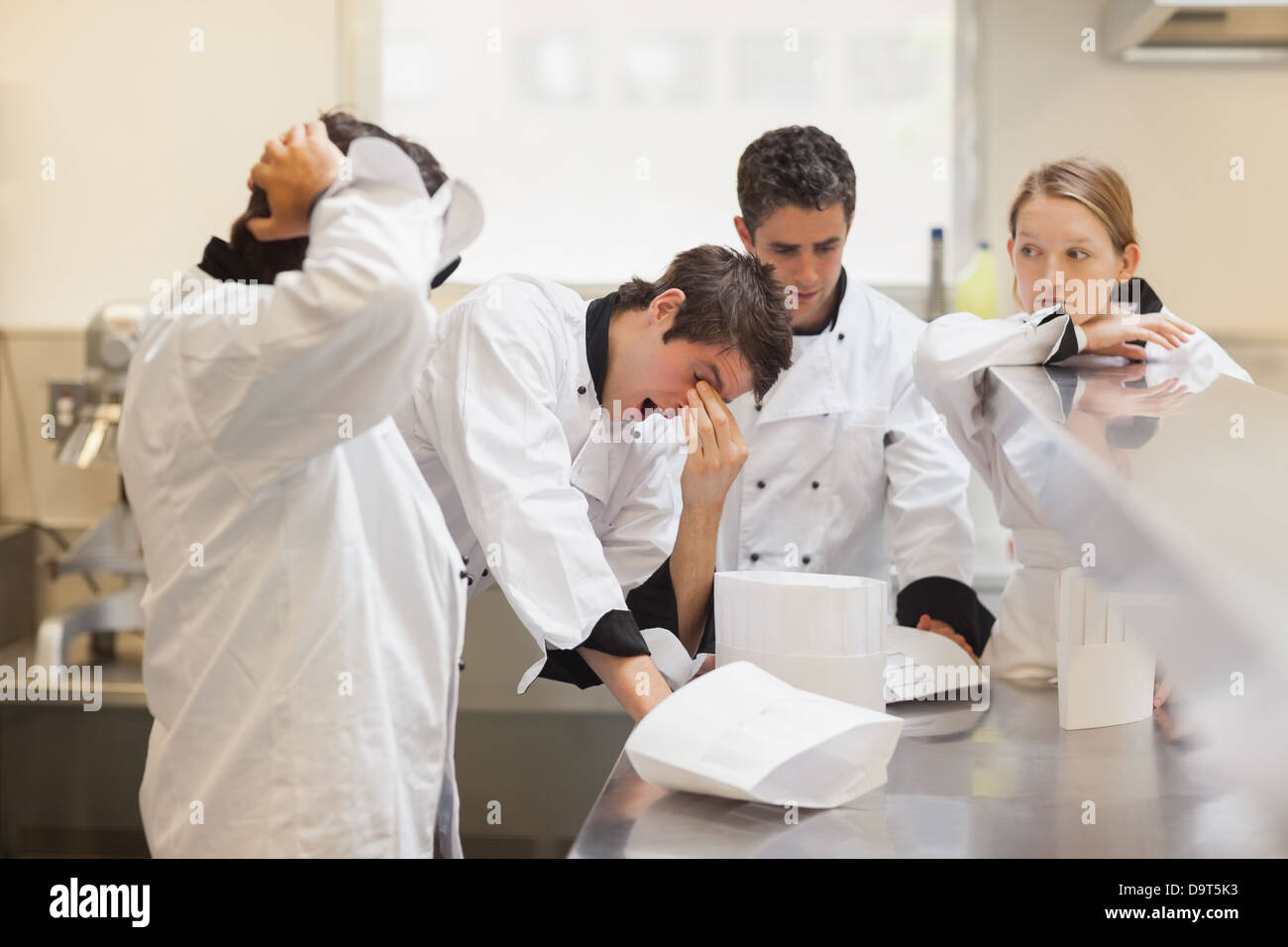 Tired chefs team waiting Stock Photo - Alamy