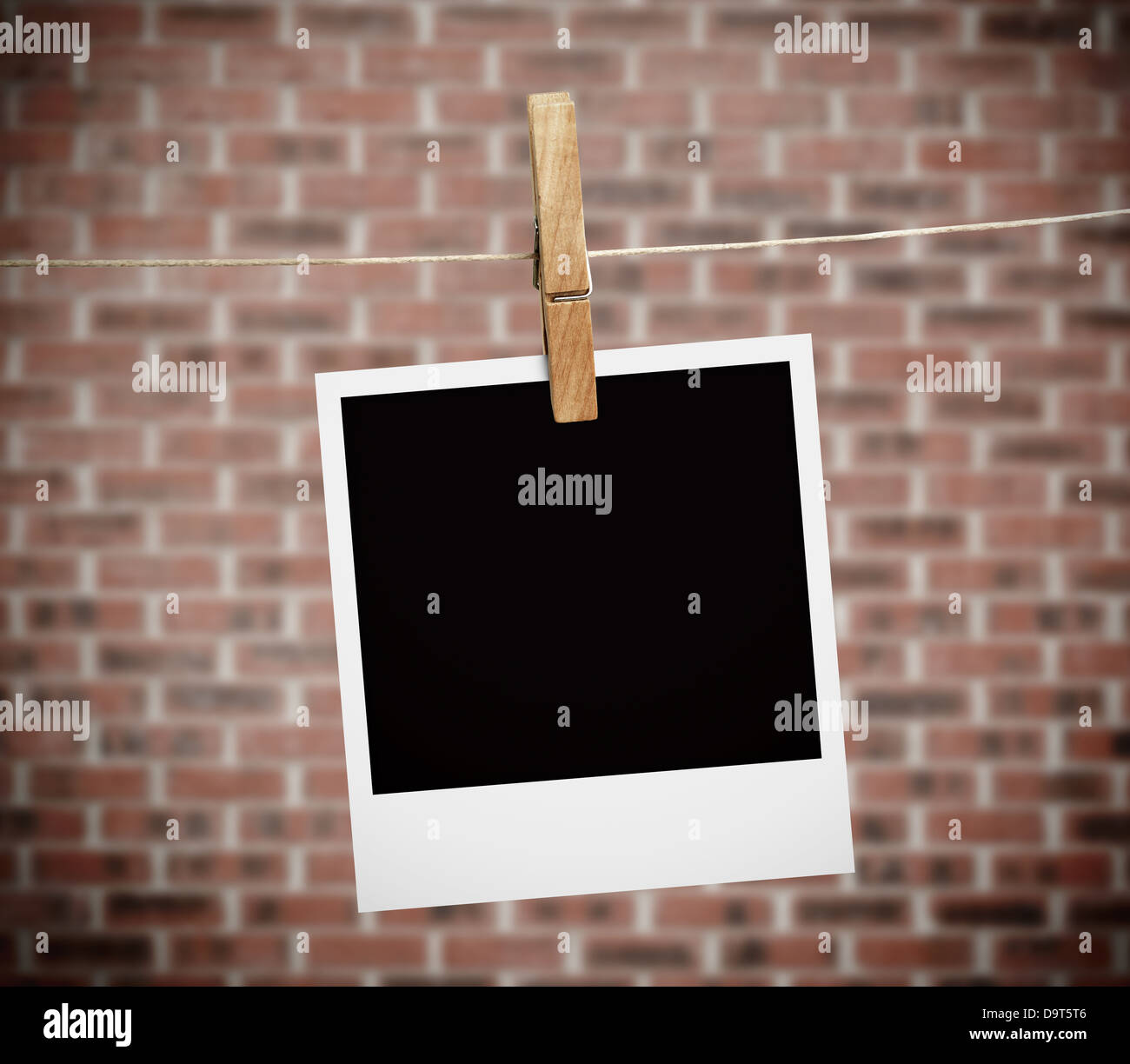 Instant photo hung with peg Stock Photo - Alamy