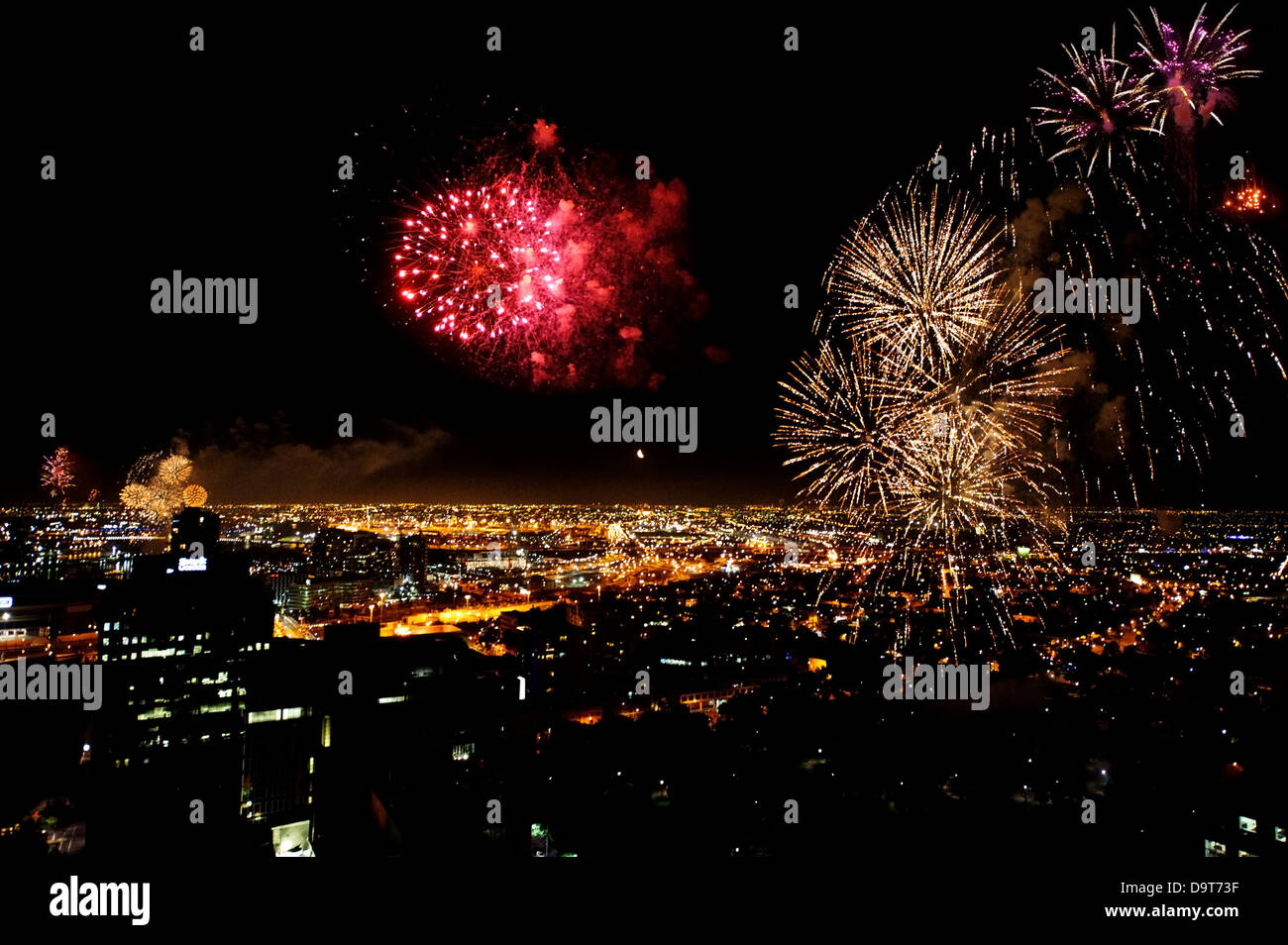 Spectacular fireworks photographed from atop a skyscraper light up the ...