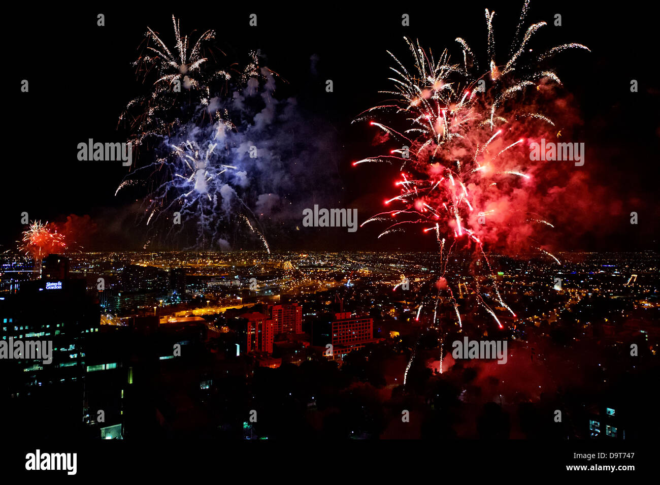 Spectacular fireworks photographed from atop a skyscraper light up the ...