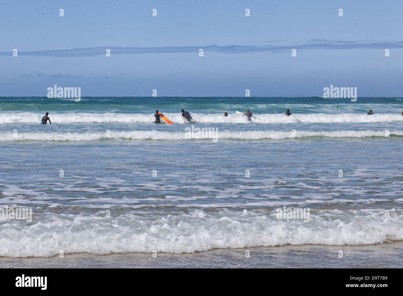 Surfers on the surf in Newquay Cornwall Stock Photo - Alamy