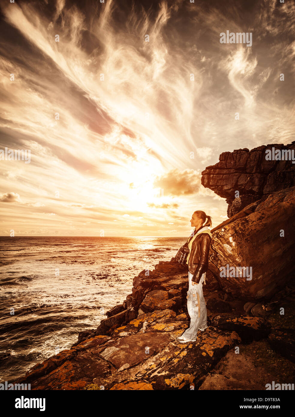 Traveler girl on the cliff, beautiful sunset on seascape, photographer ...