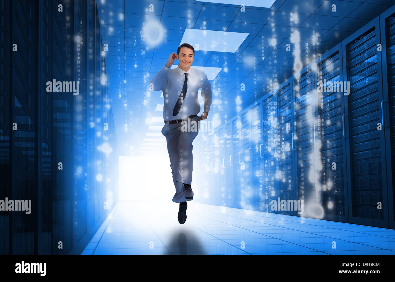 Businessman running through data center Stock Photo - Alamy
