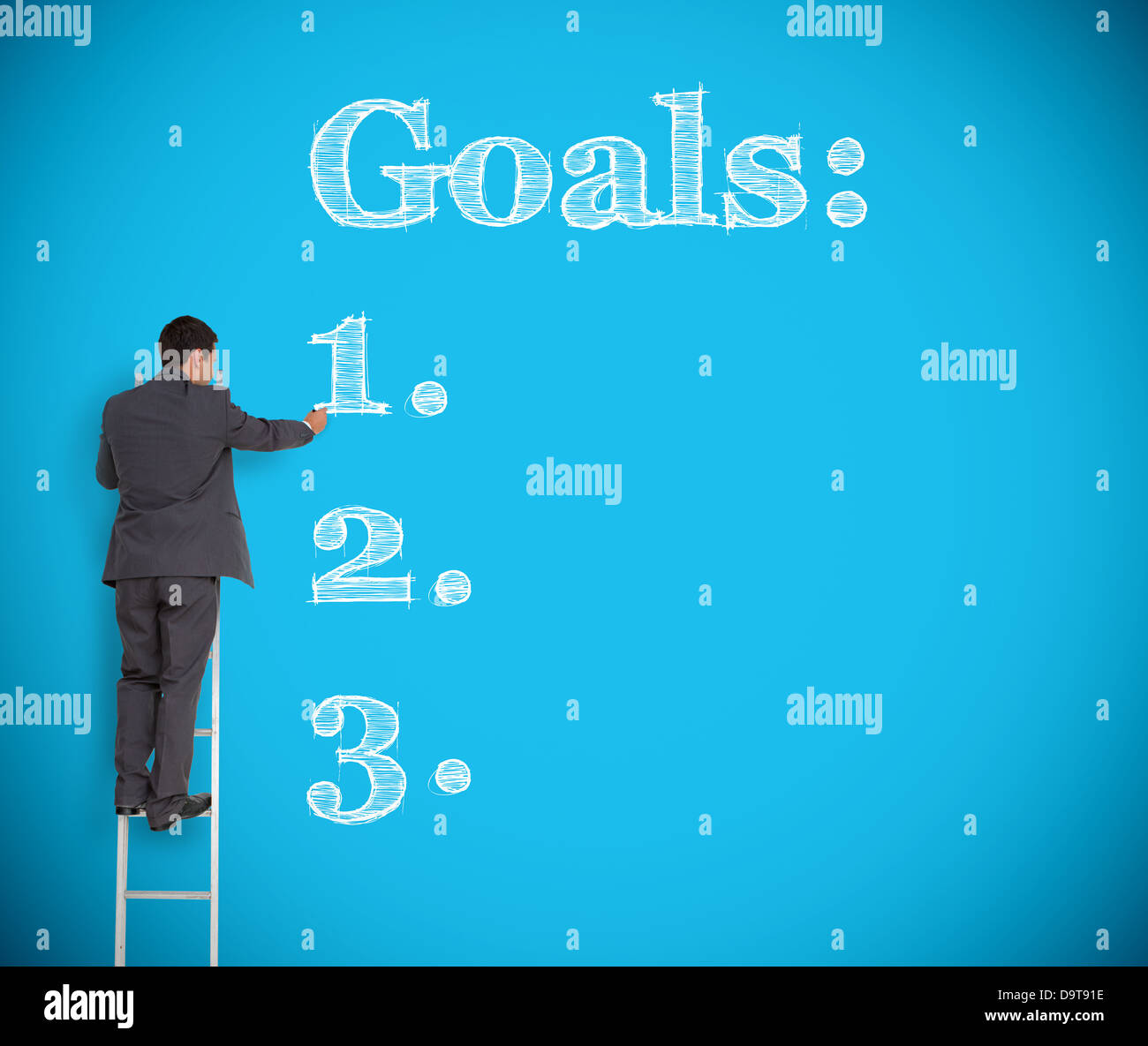Businessman writing goals on a giant wall Stock Photo - Alamy