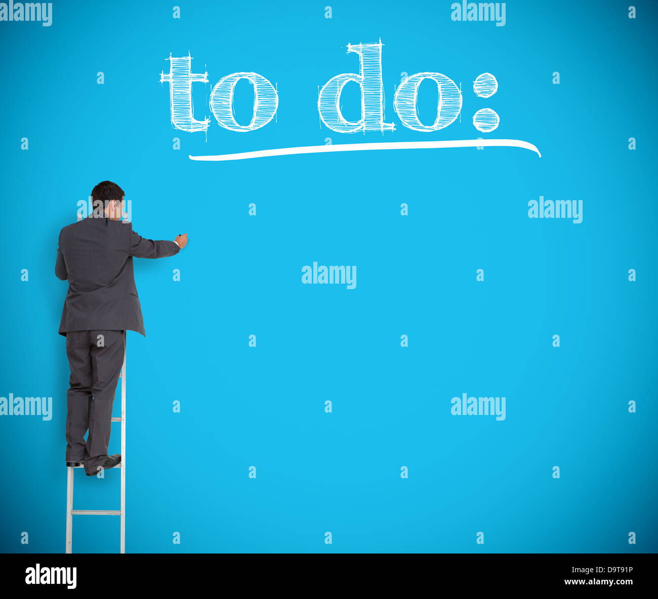 Businessman writing to do list on a blue wall Stock Photo - Alamy