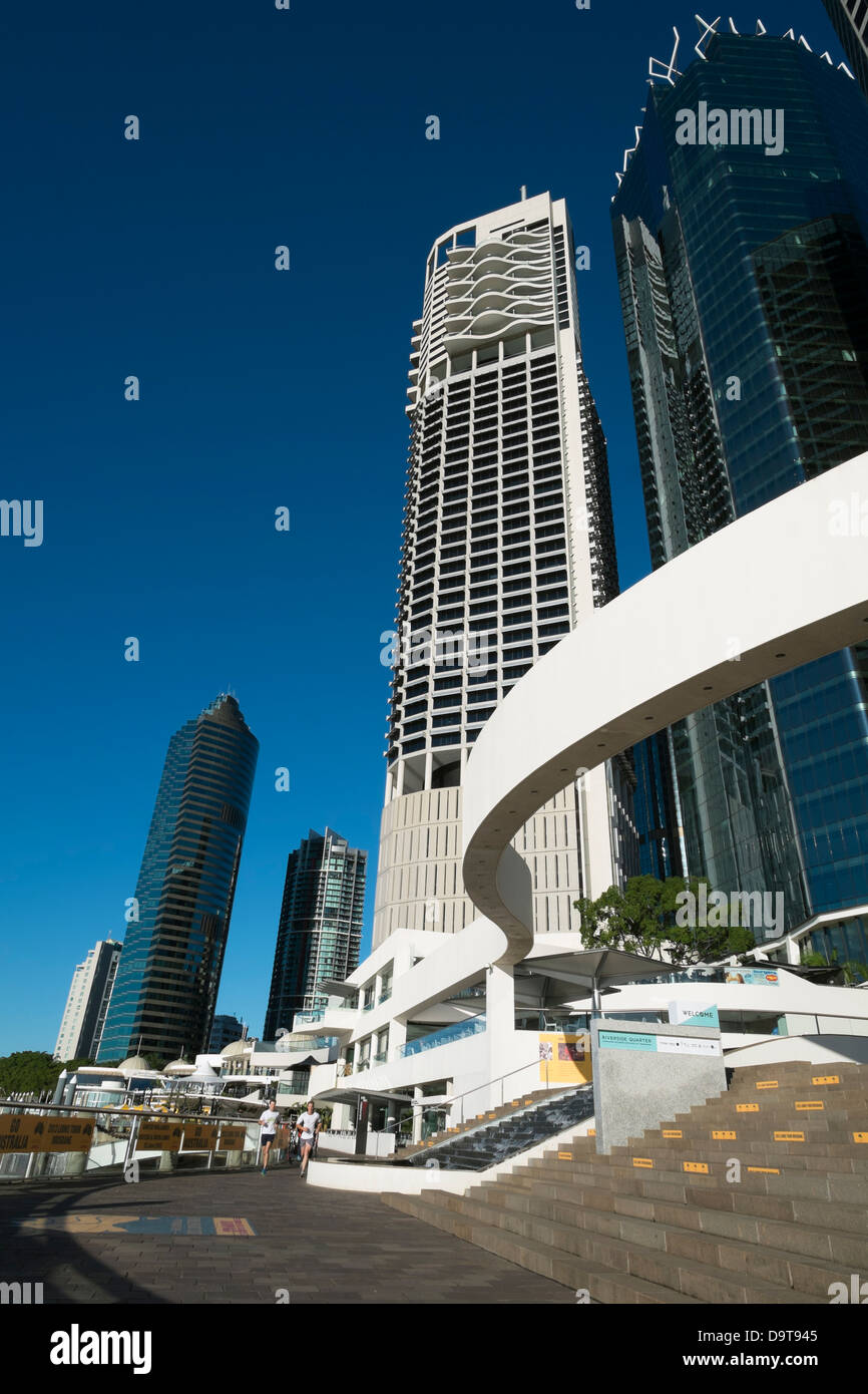 Modern high-rise buildings at Eagle Street Pier beside river in ...