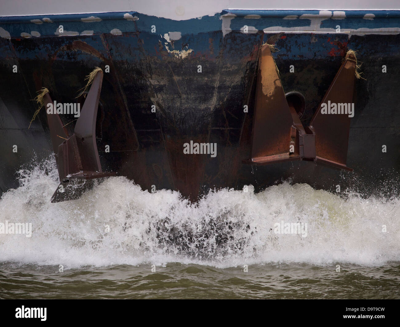 Closeup of two anchors on the bow of a moving ship in the port of ...