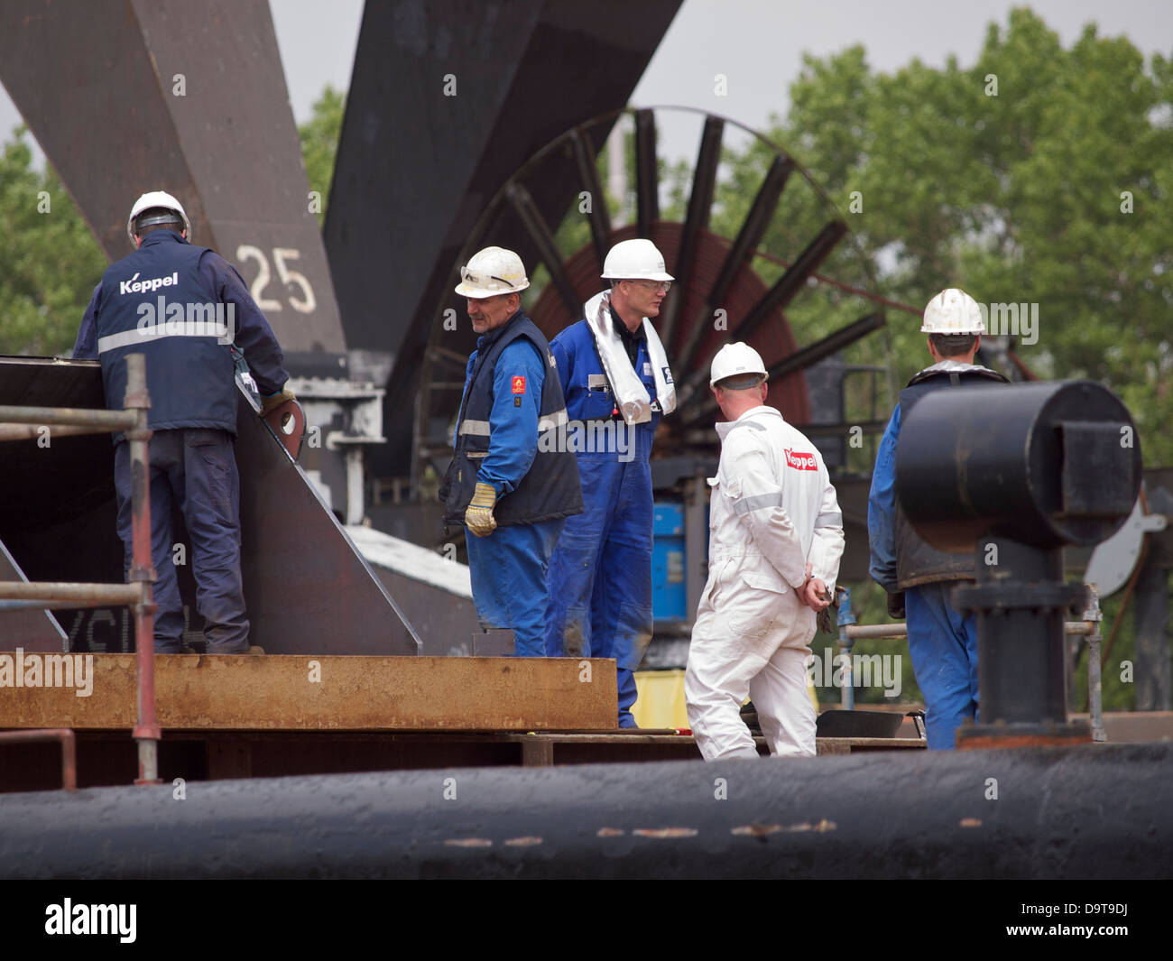 Group of men from Keppel Verolme shipyards inspecting work on a ...
