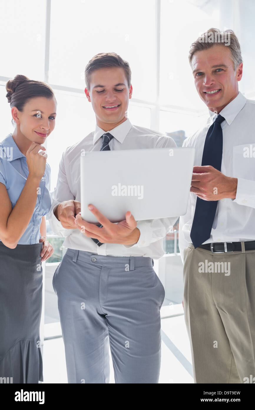Handsome employee using laptop hi-res stock photography and images - Alamy