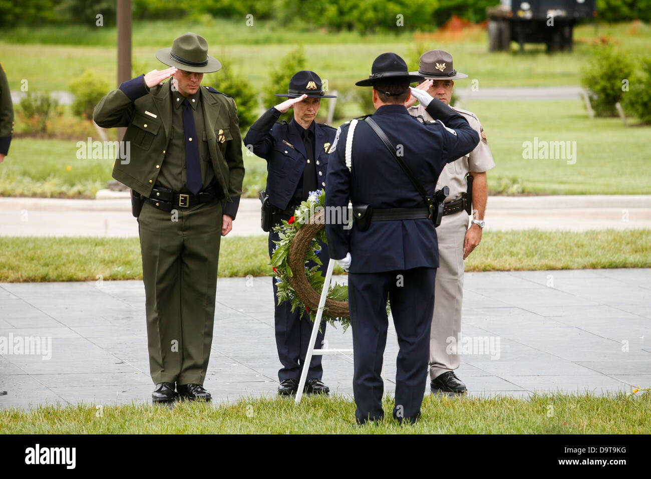 The photograph depicts the dedication of the Global College Memorial by ...