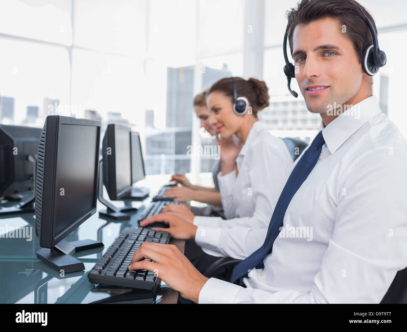 Portrait of smiling call center employee Stock Photo - Alamy