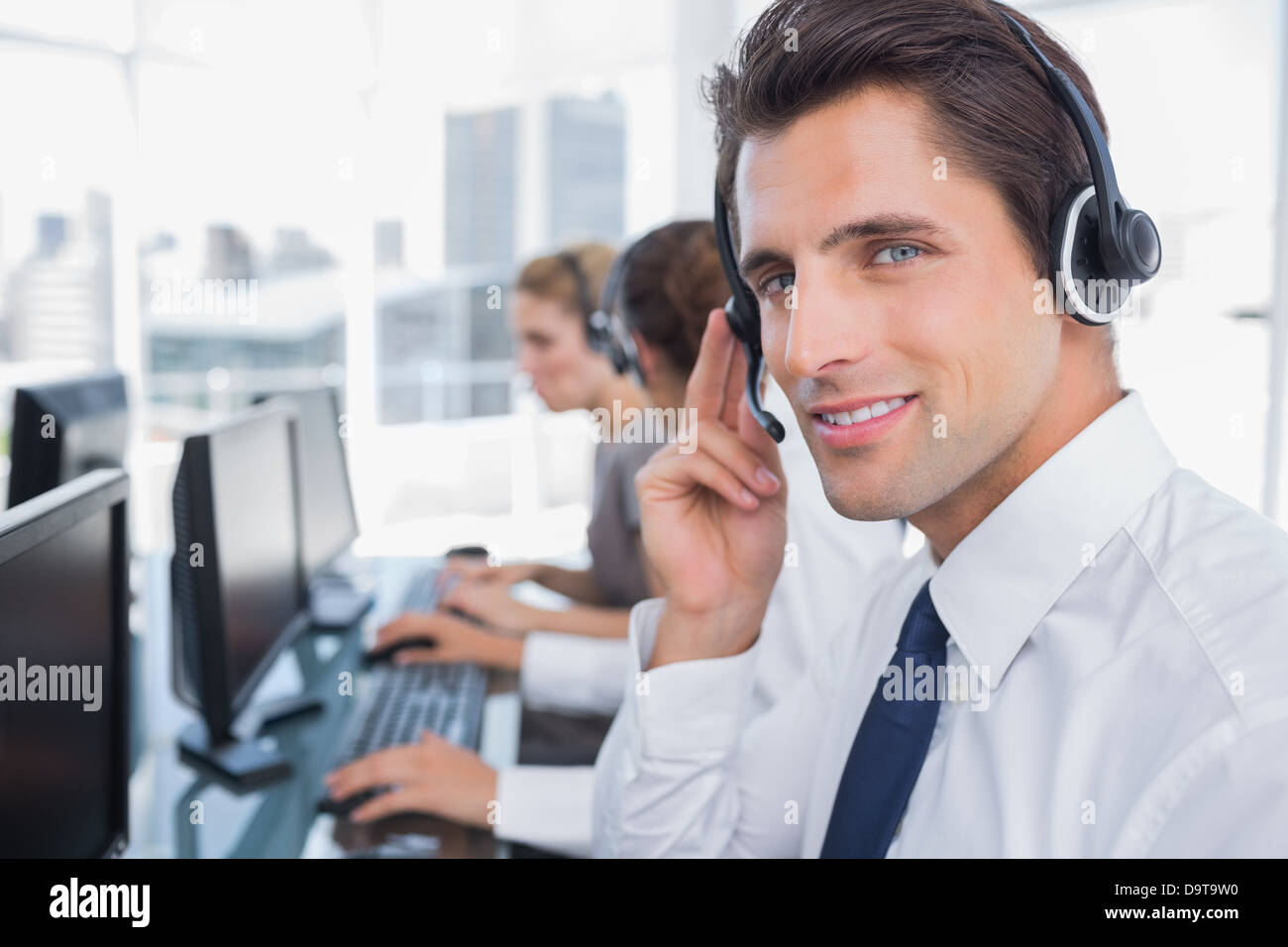 Portrait of a confident call center agent Stock Photo - Alamy