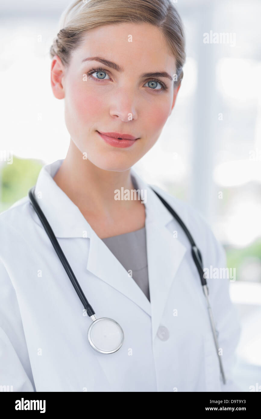Blond woman doctor standing Stock Photo - Alamy