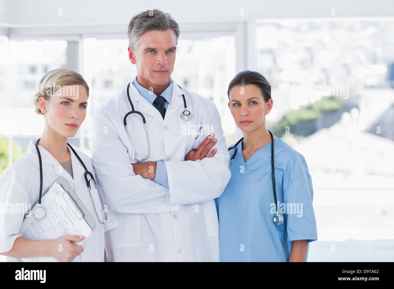 Three serious doctors Stock Photo - Alamy