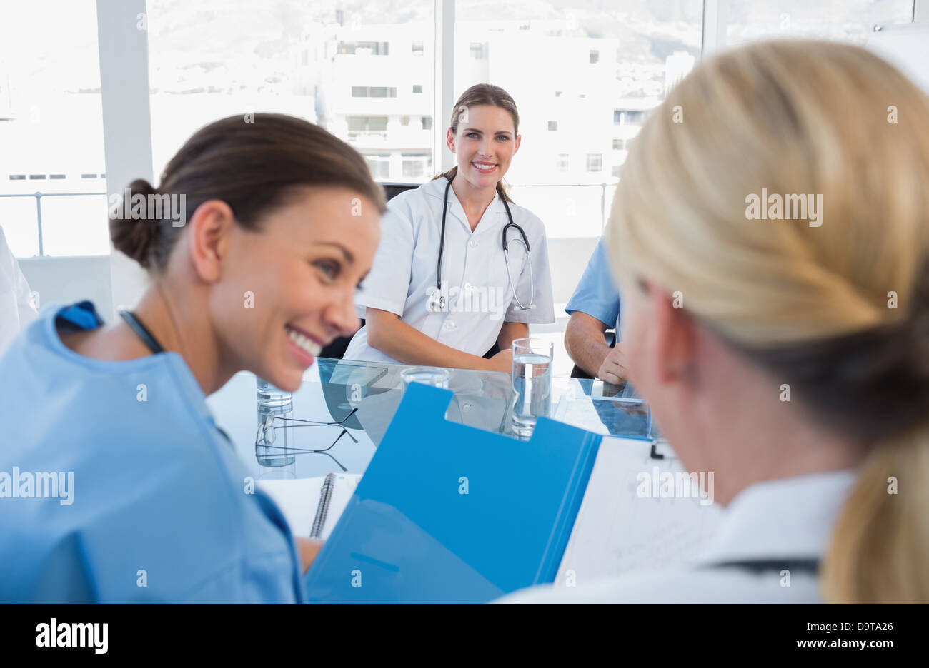 Doctors sitting in a meeting room Stock Photo - Alamy