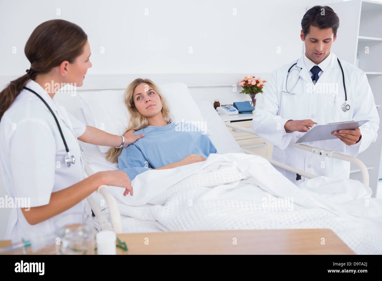 Doctor taking care of a patient Stock Photo - Alamy