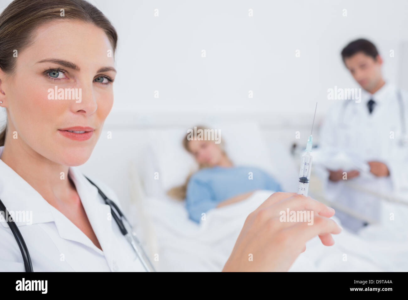 Doctor syringe hi-res stock photography and images - Alamy