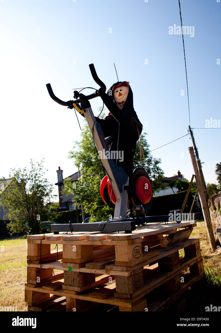 An entry in a scarecrow competition - a scarecrow riding a spin cycle ...