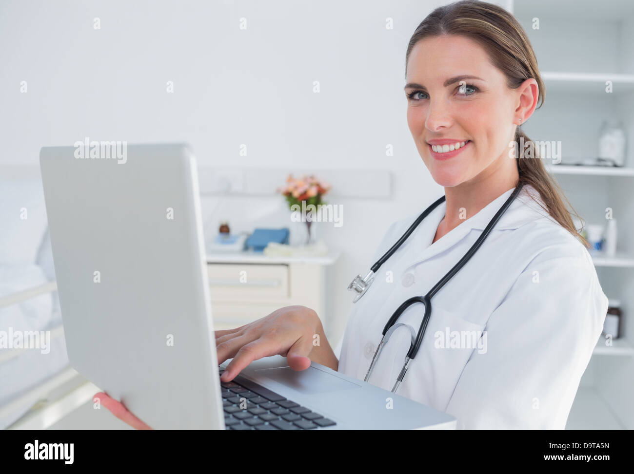 Woman looking laptop doctor hi-res stock photography and images - Alamy