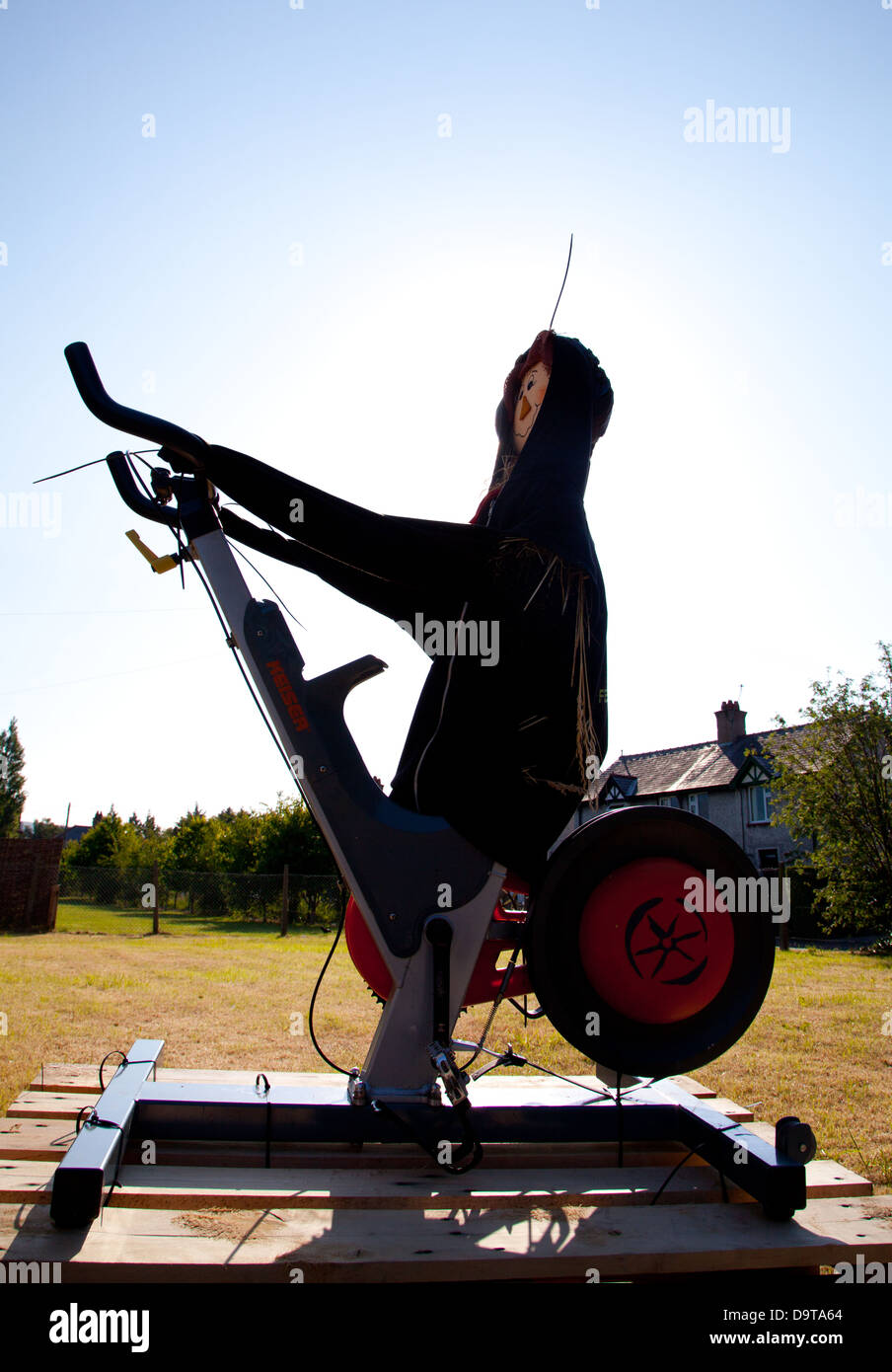An entry in a scarecrow competition - a scarecrow riding a spin cycle ...
