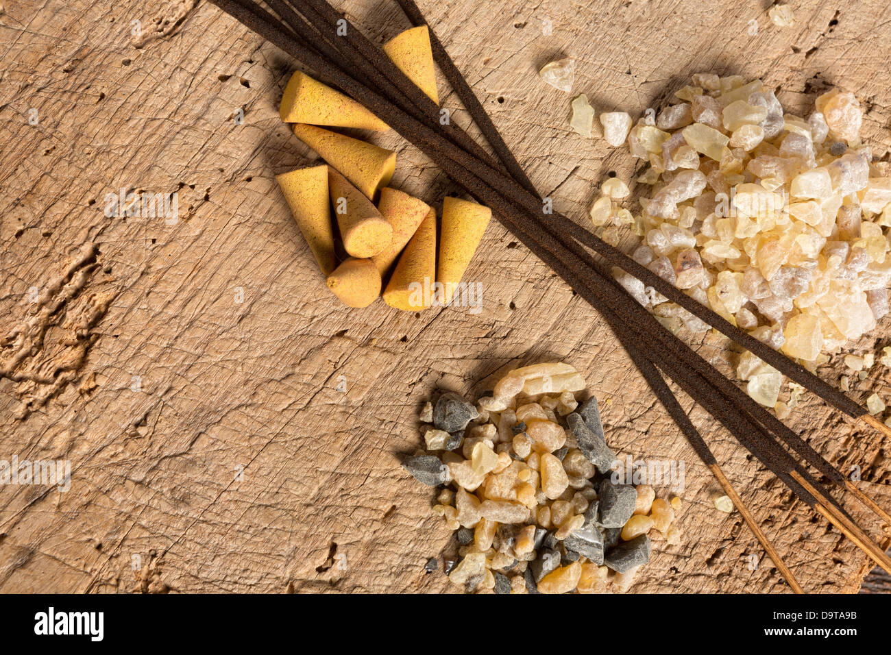 Wooden table with incense in different forms Stock Photo - Alamy