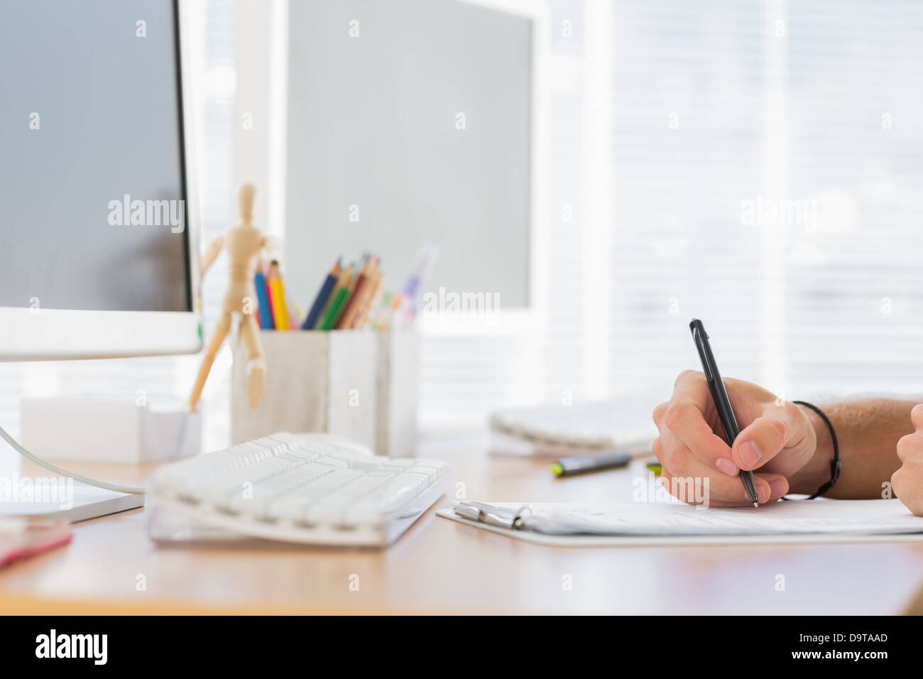 Hand writing in a modern office Stock Photo - Alamy