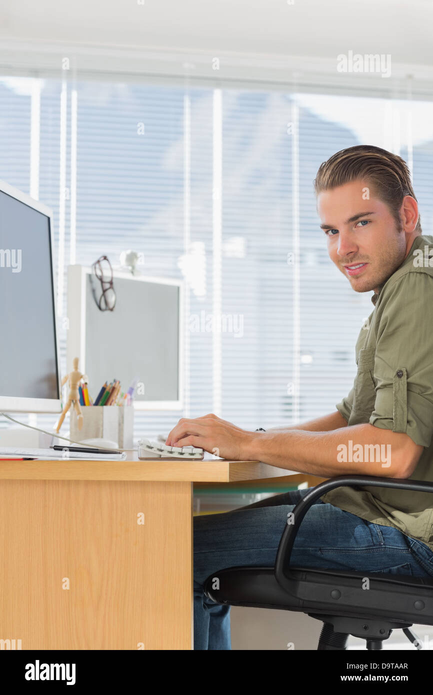 Cheerful creative business employee working on computer Stock Photo - Alamy