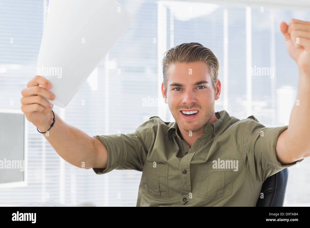 Happy man raising arms victory hi-res stock photography and images - Alamy