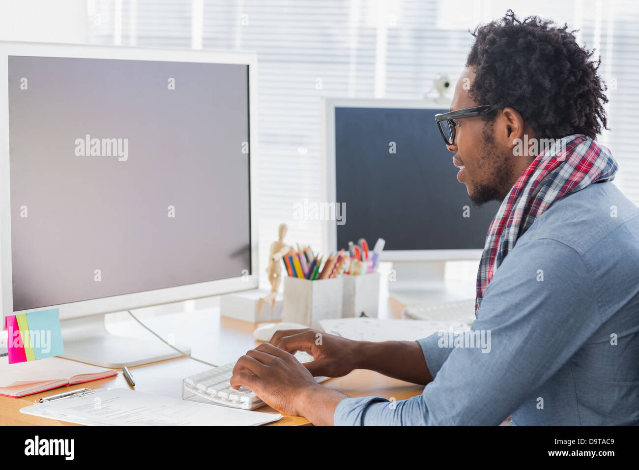 Creative business worker on computer Stock Photo - Alamy