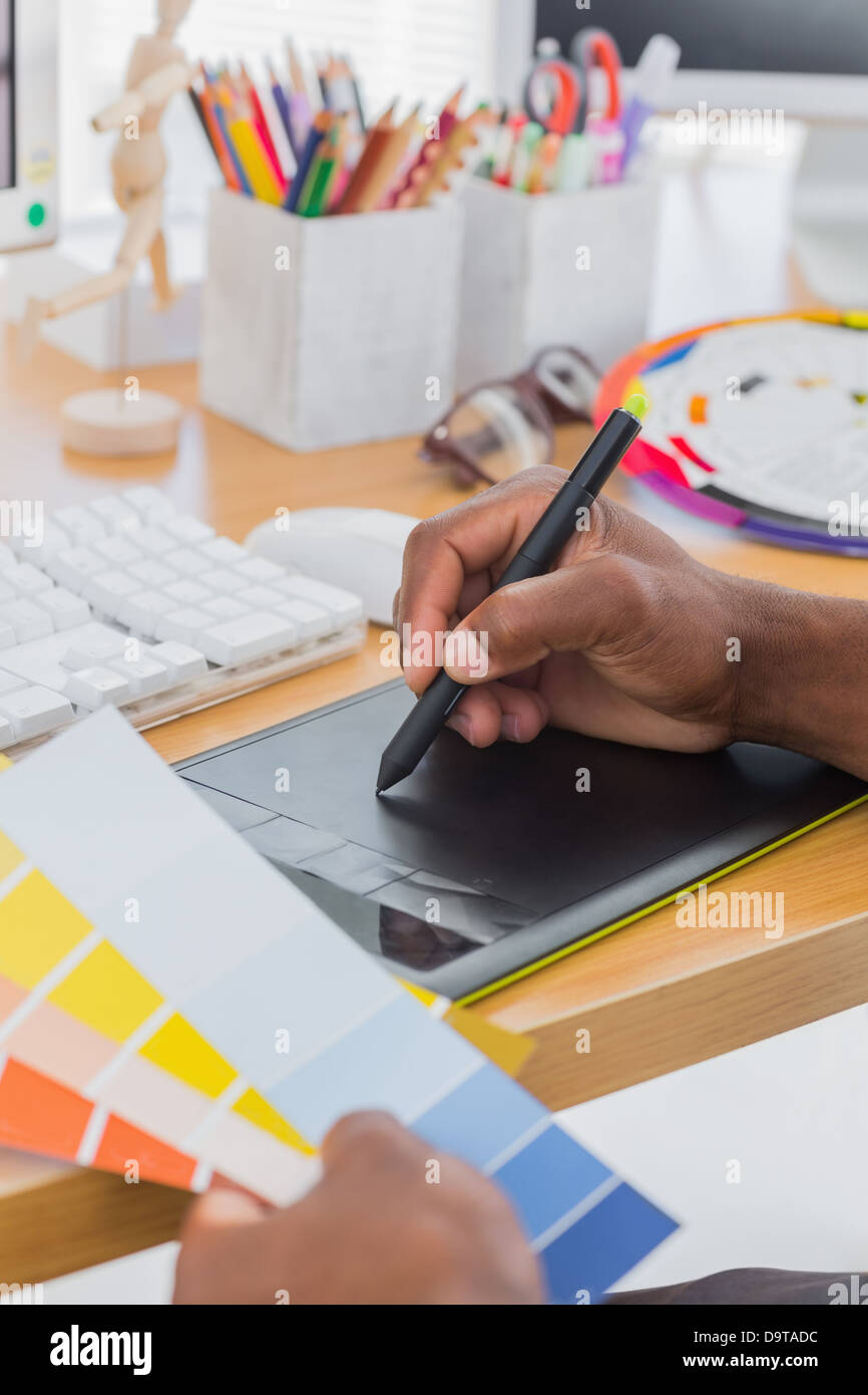 Interior designer with graphics tablet and colour chart Stock Photo - Alamy