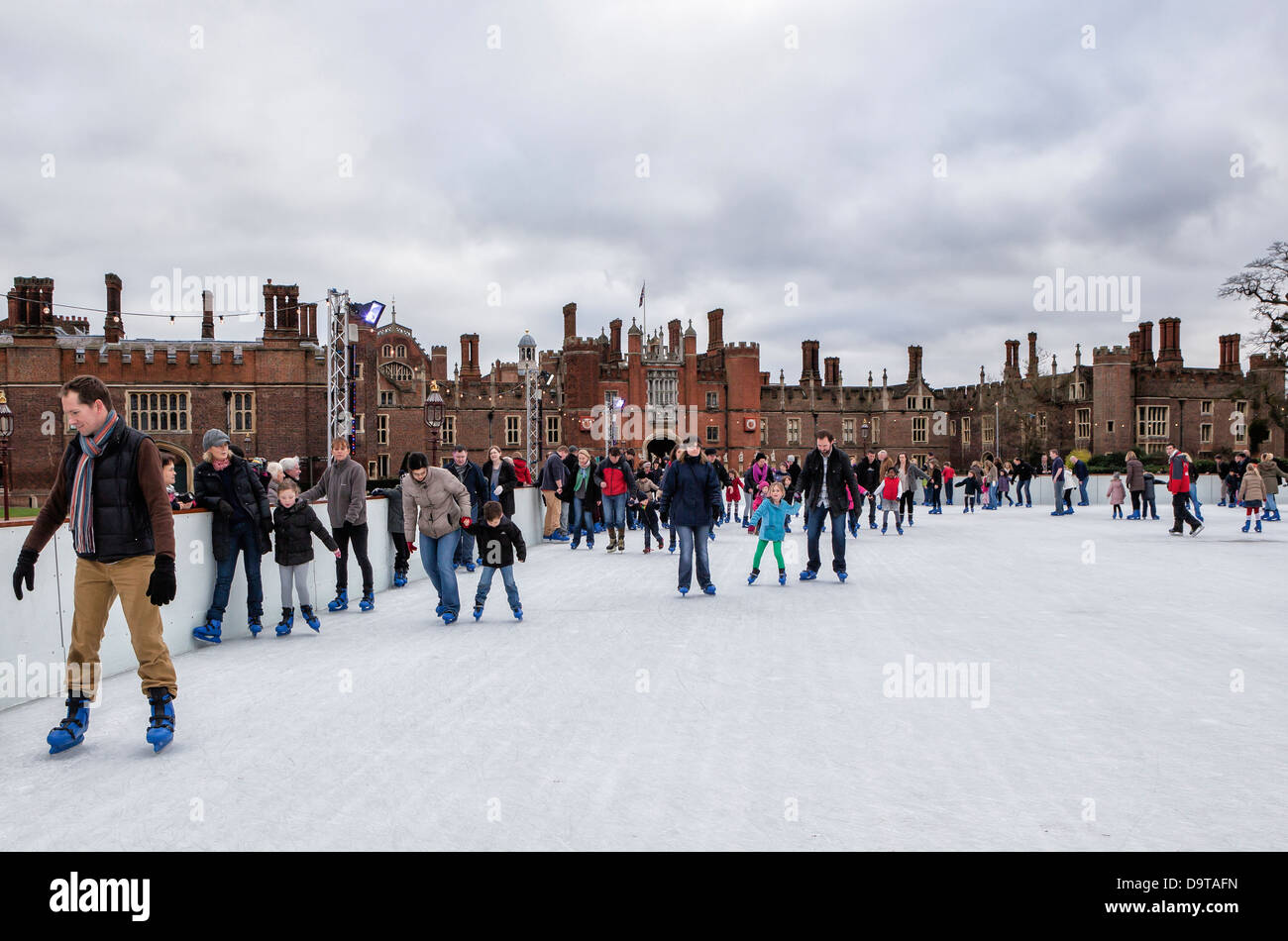 People enjoy skating on the temporary ice rink at Hampton Court Palace ...