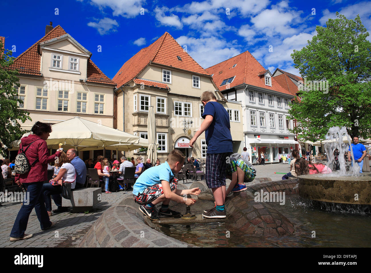 Pedestrian Area and kids playing at roman fountain at Pferdemarket ...