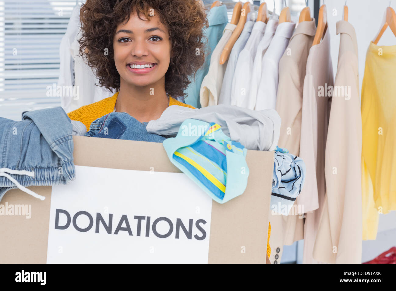 Happy volunteer smiling Stock Photo - Alamy