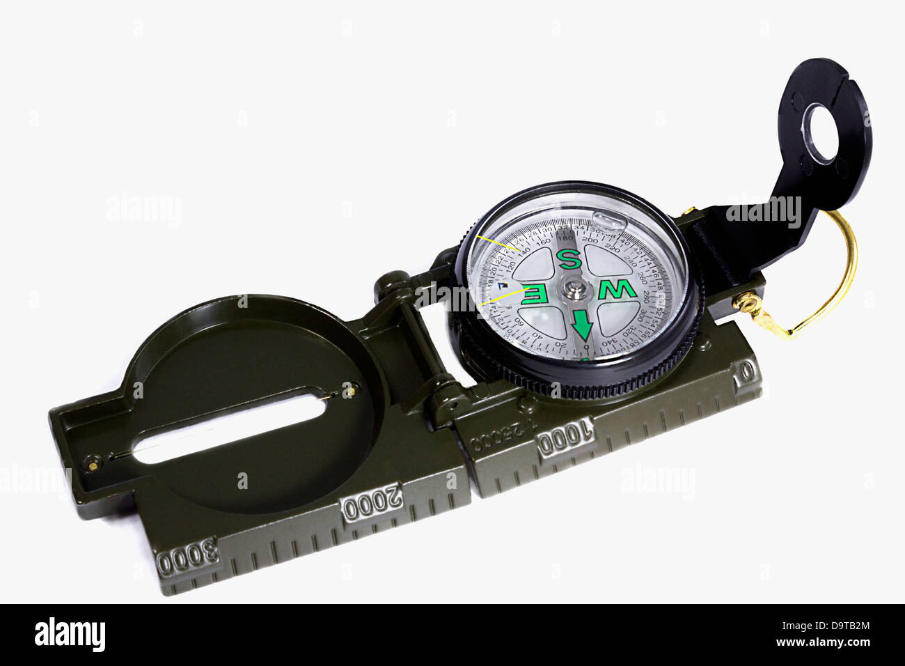 A small compass folding in a frame of metal. Presented on a white ...